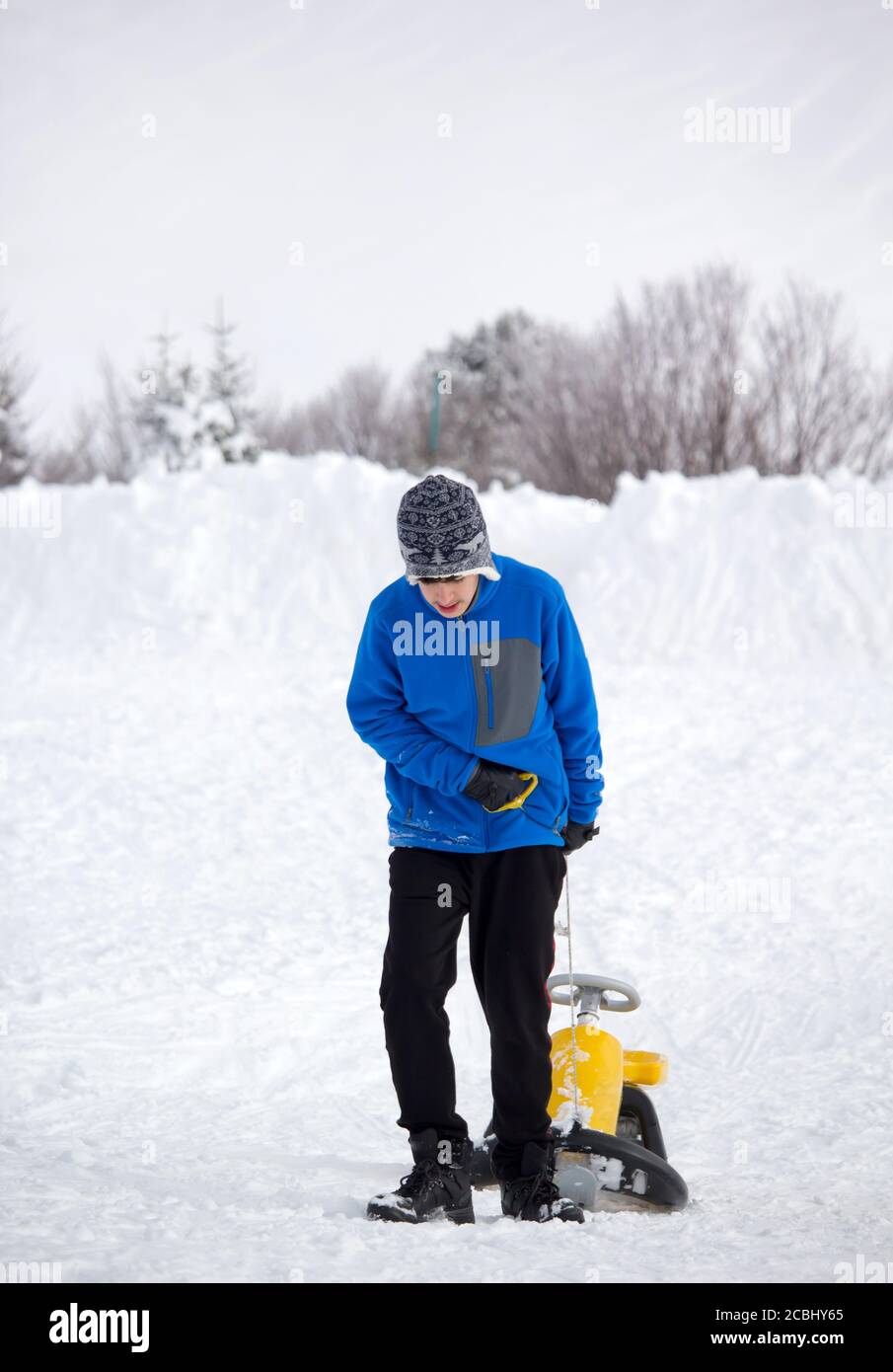 Male model posing in snow hi-res stock photography and images - Alamy