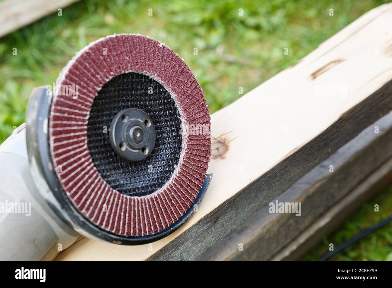 The electric wood sander lies on a smooth board Stock Photo - Alamy
