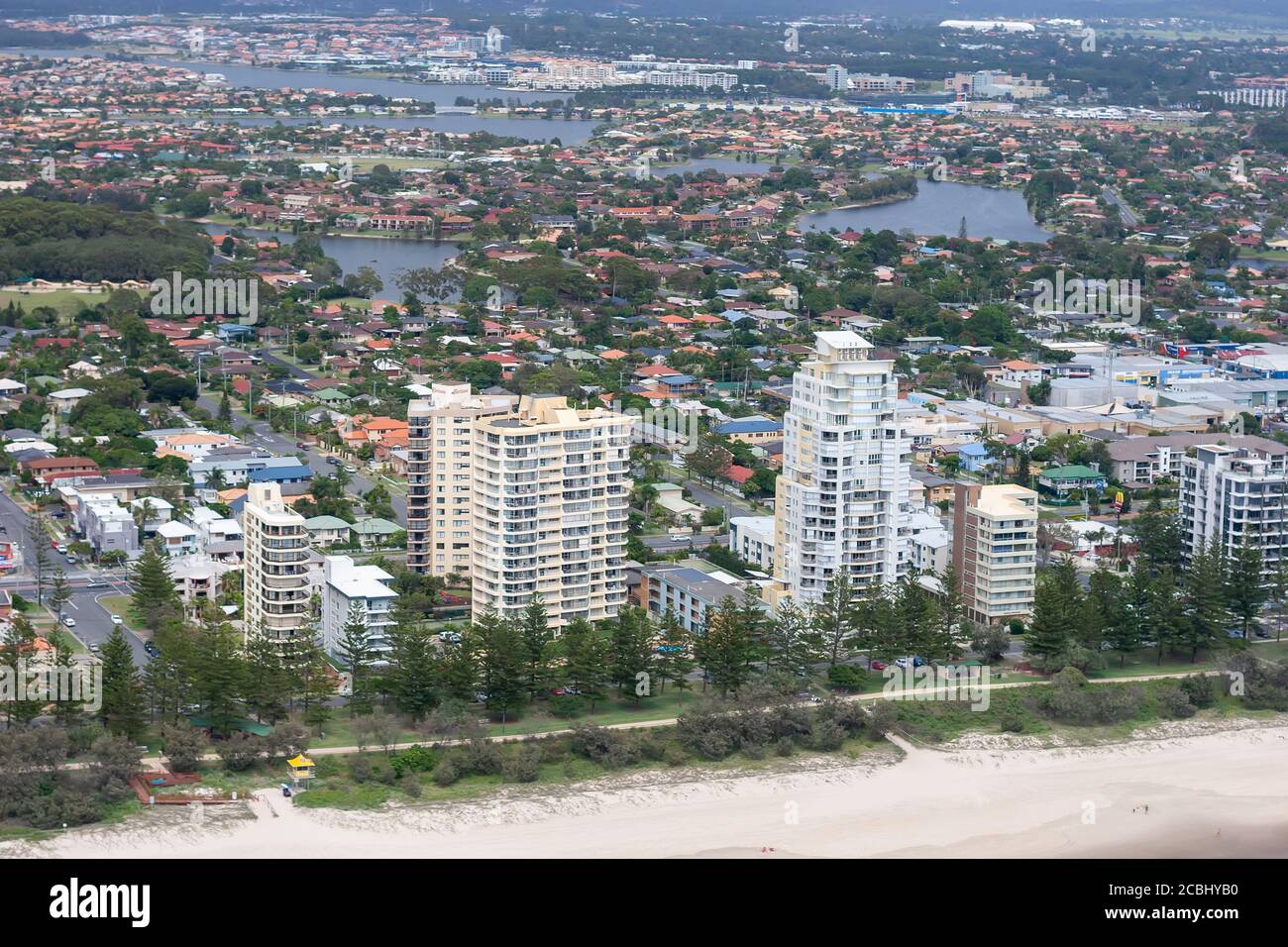 Empty beach in front of a city Stock Photo - Alamy