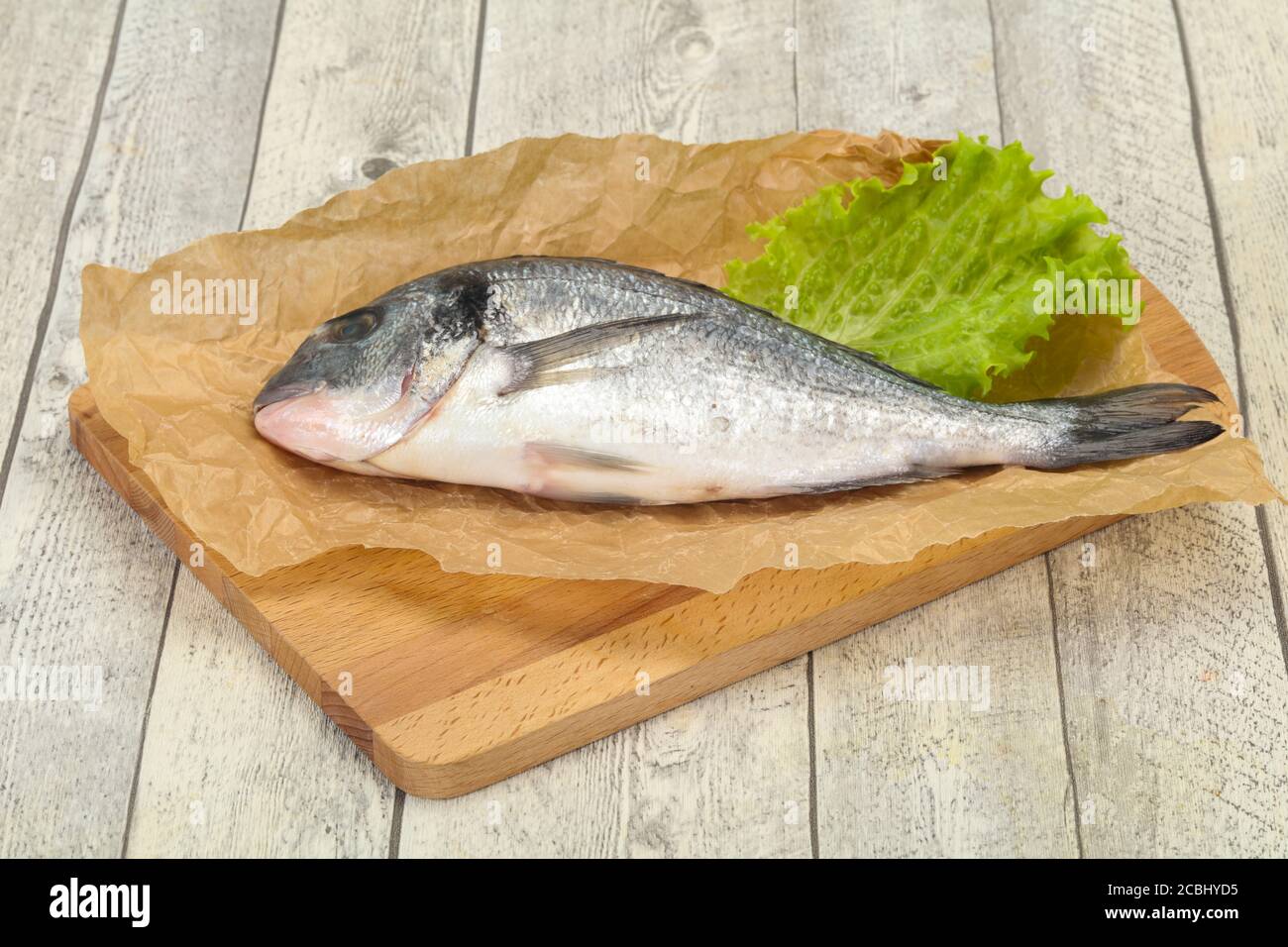 Raw Dorada fish ready for cooking Stock Photo - Alamy