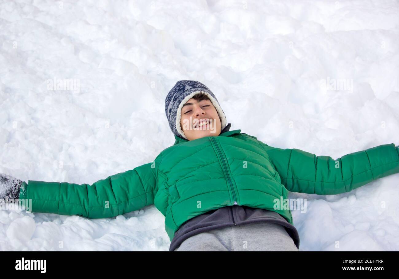 Portrait of happy boy in the snow Stock Photo - Alamy
