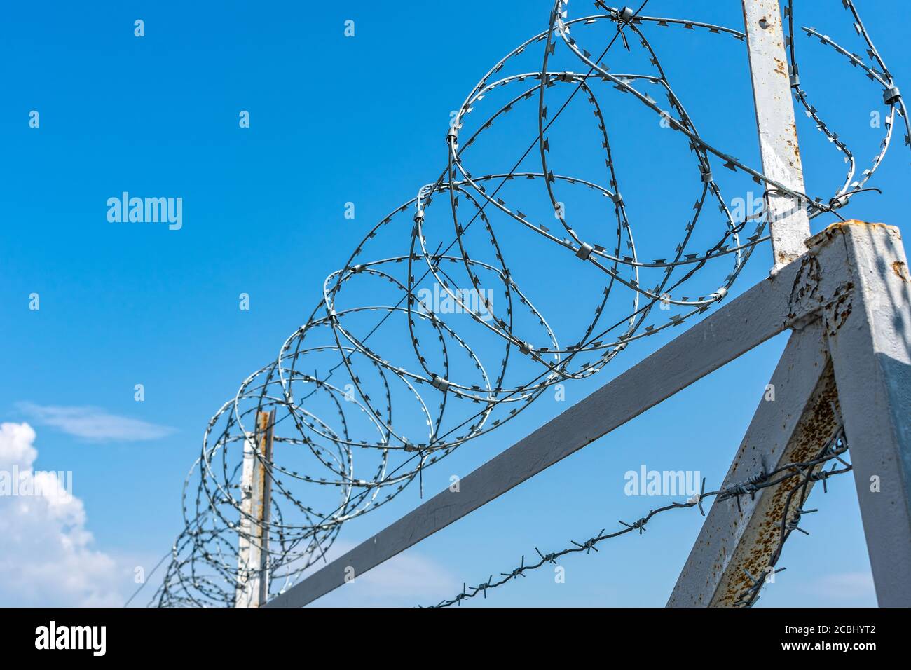 Live barbed wire fence to protect against entry into restricted areas ...
