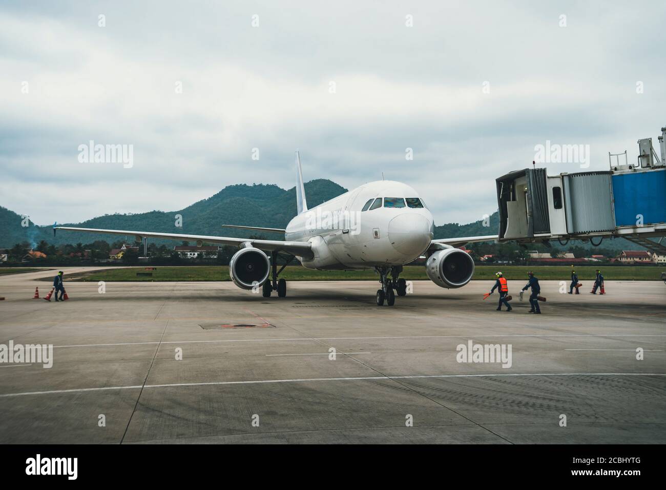 Boarding plane terminal. Airplane at the gate in airport. An airplane ...