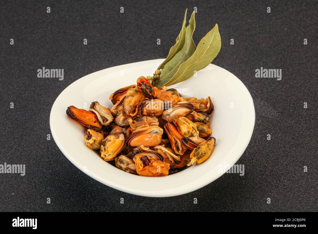 Pickled mussels with spices in the bowl Stock Photo - Alamy