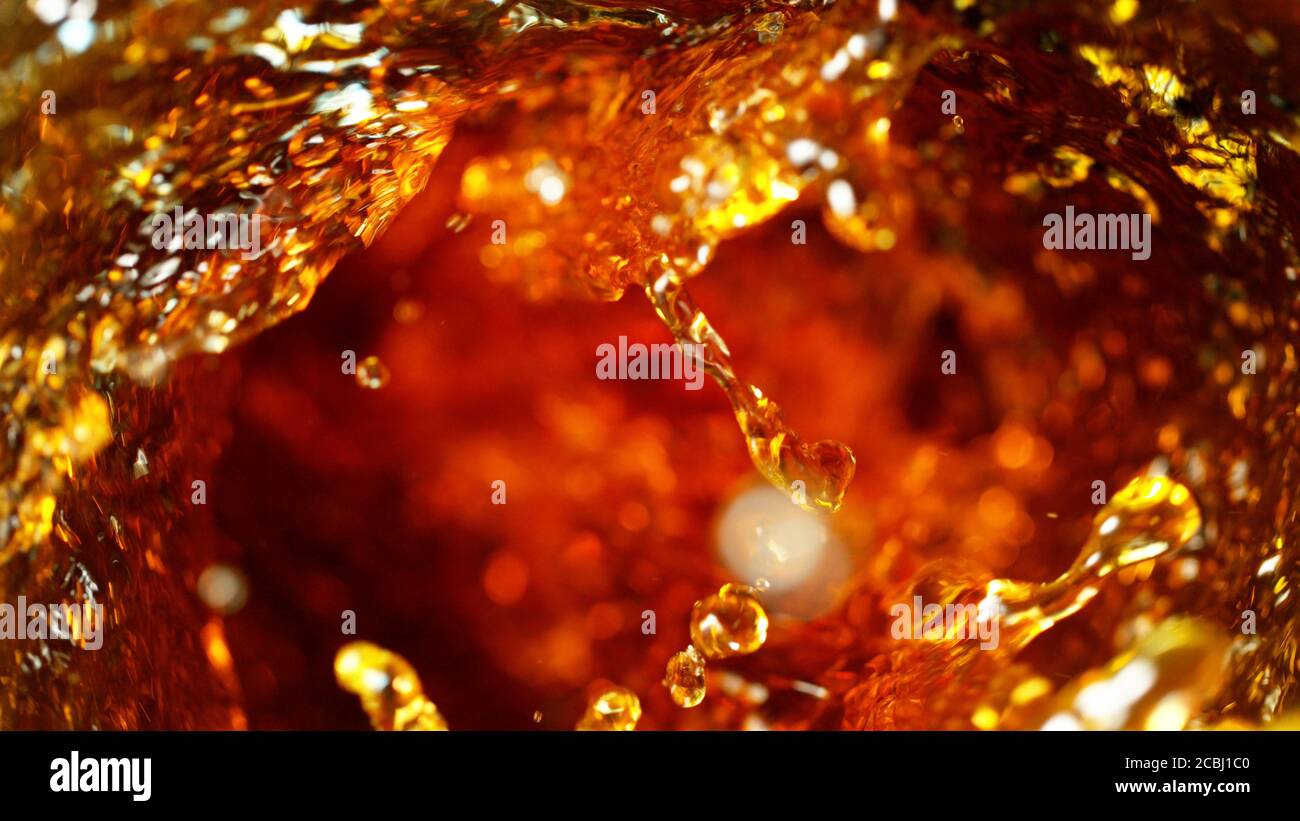 Detail of cola, tea or hard spirit beverages whirl, abstract fresh ...