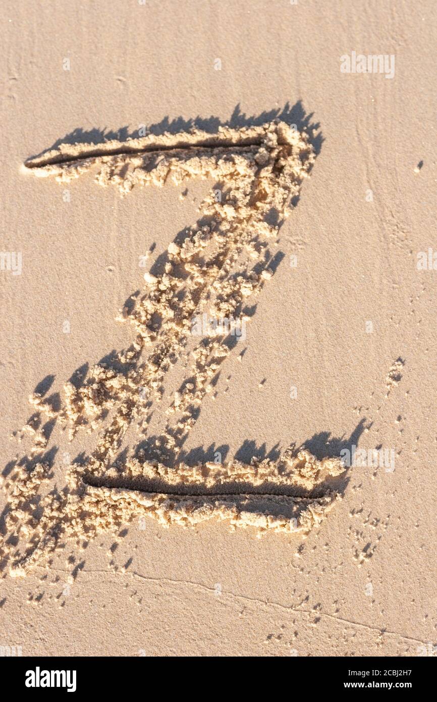 Z - Alphabet letter written on sand Stock Photo - Alamy