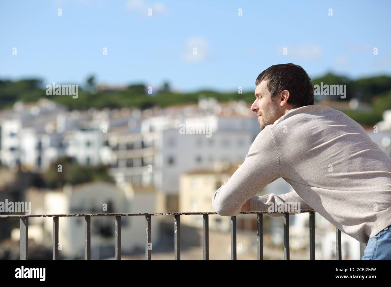 Handsome guy looking relaxed enjoying hi-res stock photography and ...