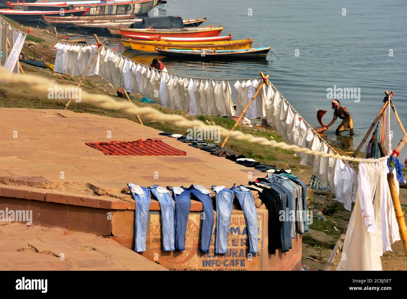 Dhobi wallahs doing laundry in Ganges River, Varanasi (Benares, Banaras ...