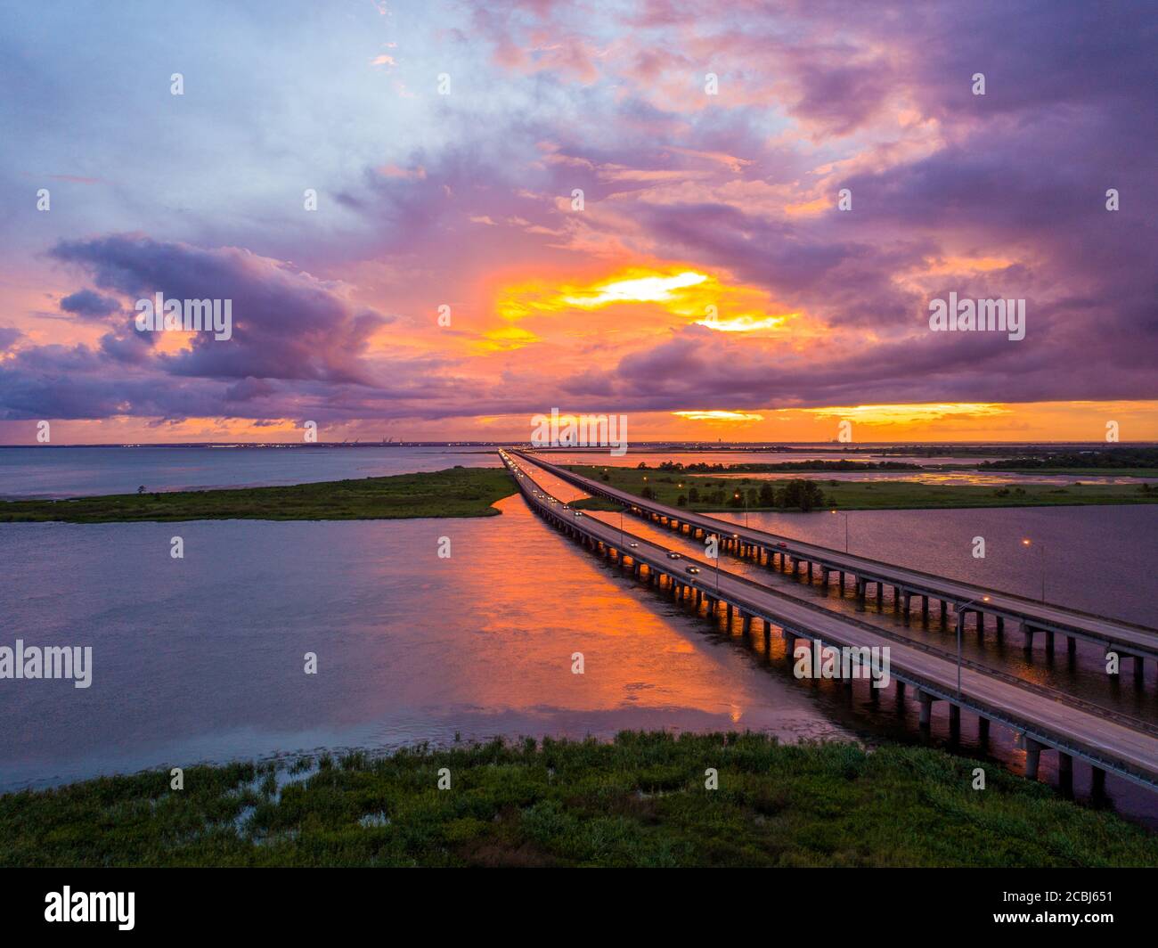 Mobile Bay and interstate 10 bridge at sunset Stock Photo - Alamy