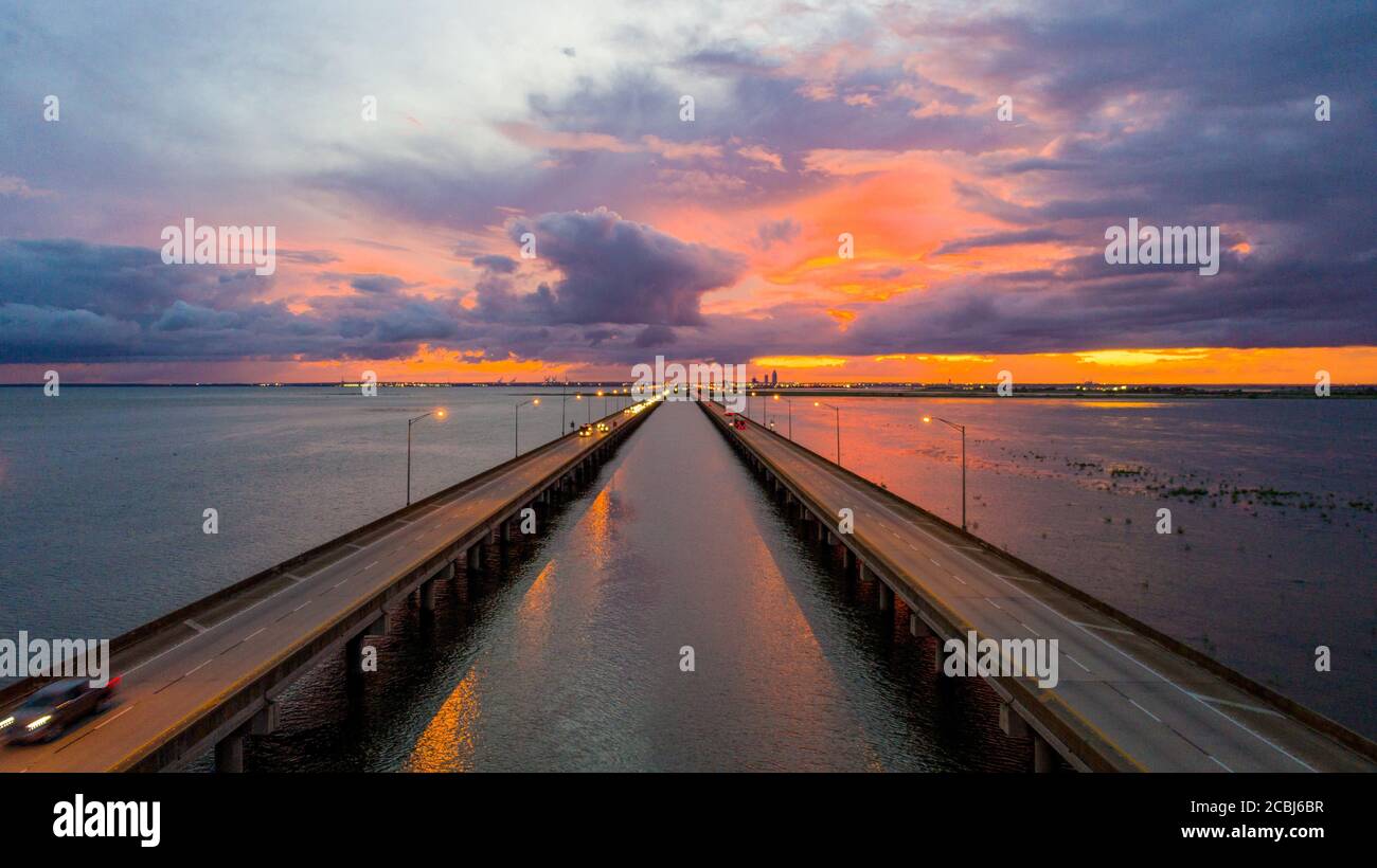 Mobile Bay and interstate 10 bridge at sunset Stock Photo - Alamy