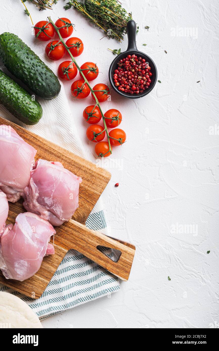 Gyros ingredients, raw chicken meat on white backgroundtop viewwith ...