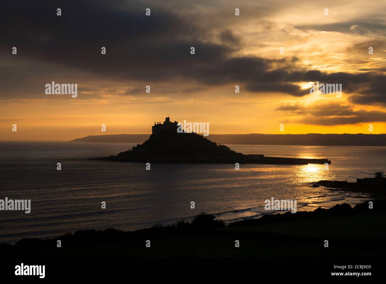 Silhouette of St. Michael's Mount, Marazion, Cornwall at sunset with ...