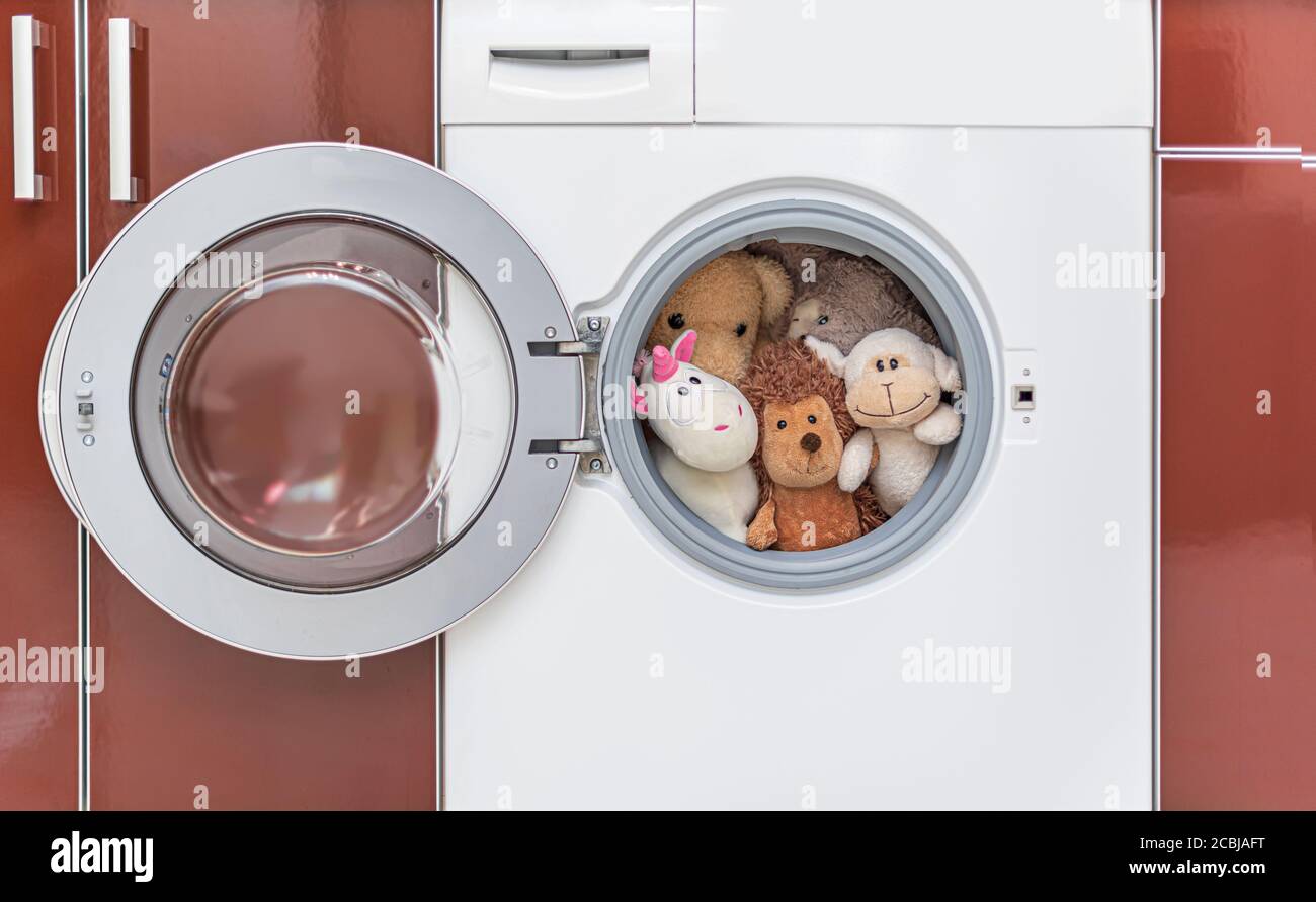 Plush toys are being prepared for washing Stock Photo - Alamy