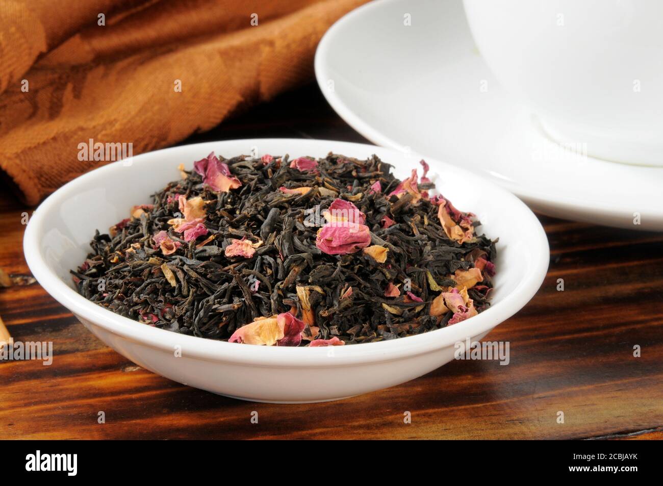 A sample dish of rose infused whole leaf black tea Stock Photo - Alamy