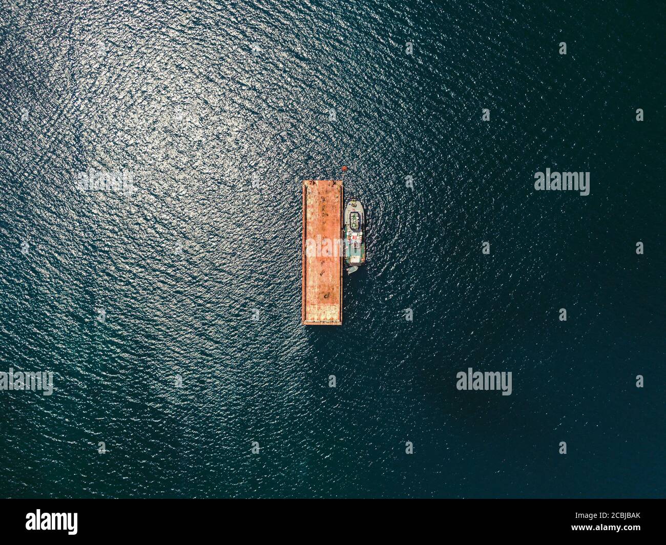 Top down view of rusty barge in the middle of the ocean Stock Photo - Alamy