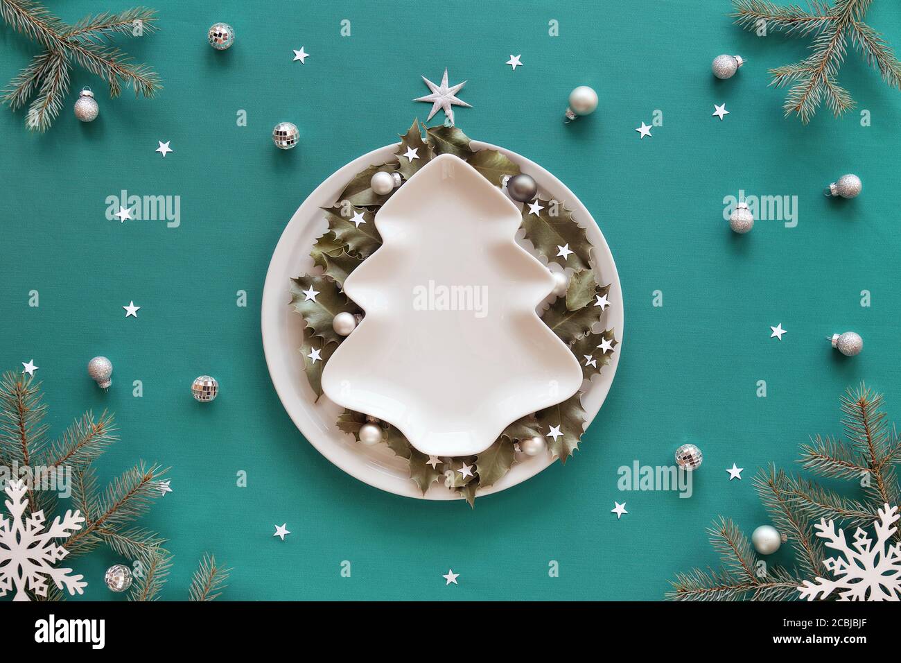 Christmas background in green and white. Xmas tree shape plate with ...