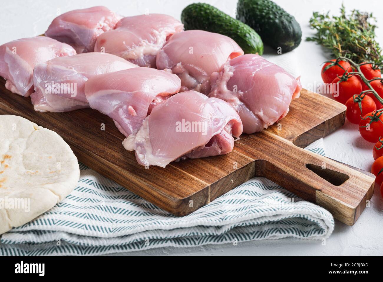 Shawarma ingredients, chicken thighs on white background Stock Photo ...