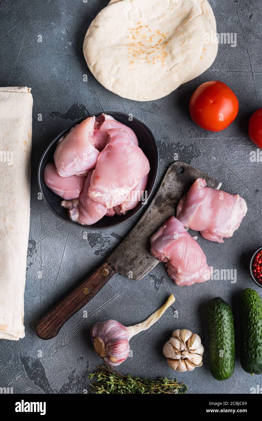 Raw doner ingredients, chicken thighs on grey backgroundtop view Stock ...