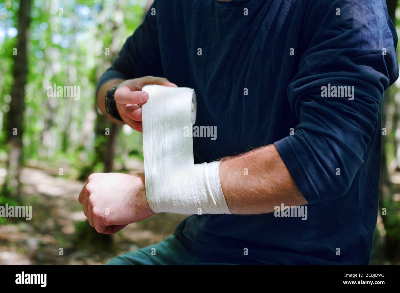 Applying an arm medical bandage Stock Photo - Alamy