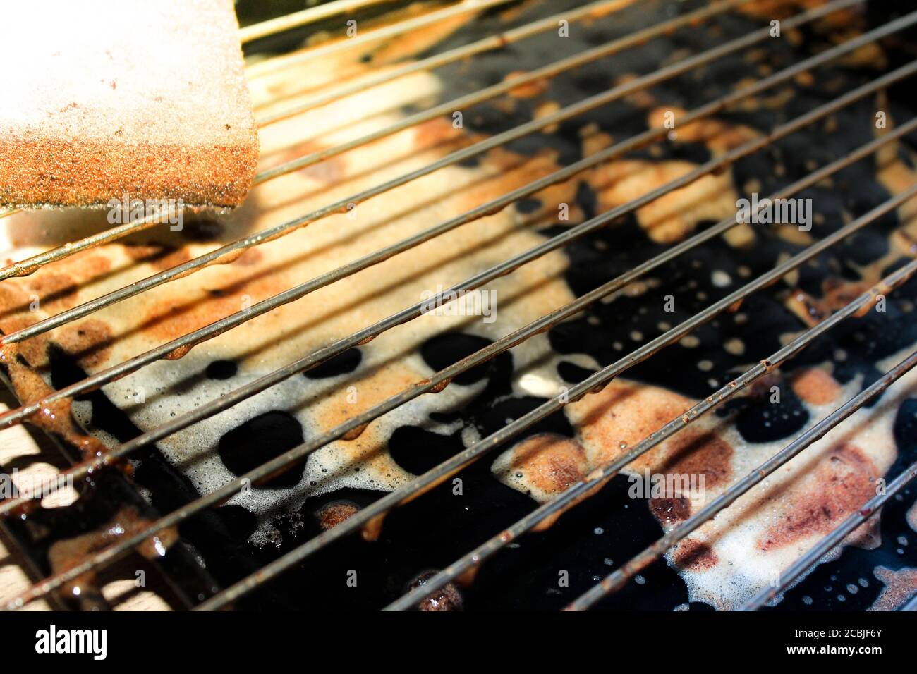 Fat and meat residues on the wire shelf after cooking Stock Photo - Alamy