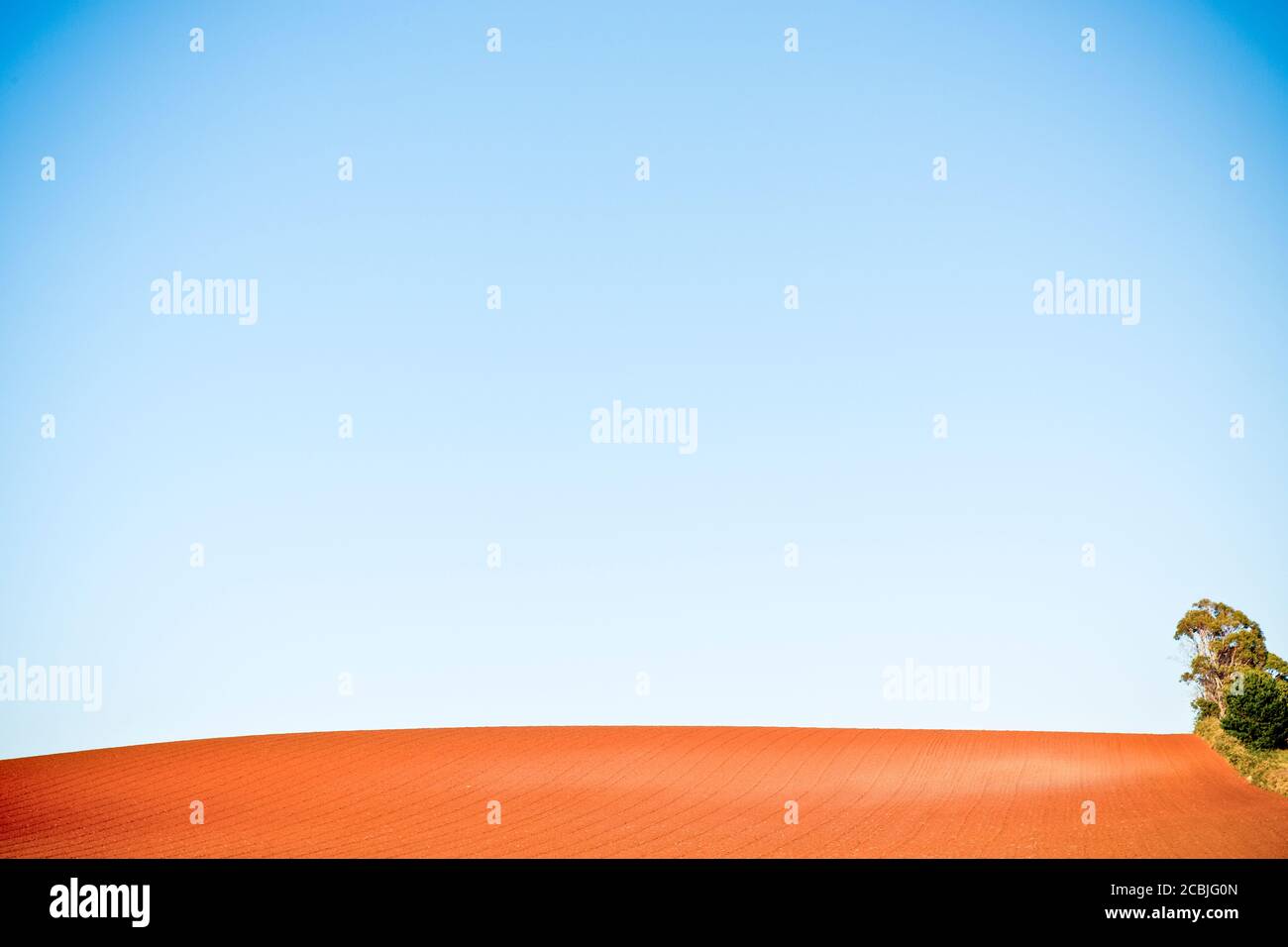Red desert and clear sky Stock Photo - Alamy