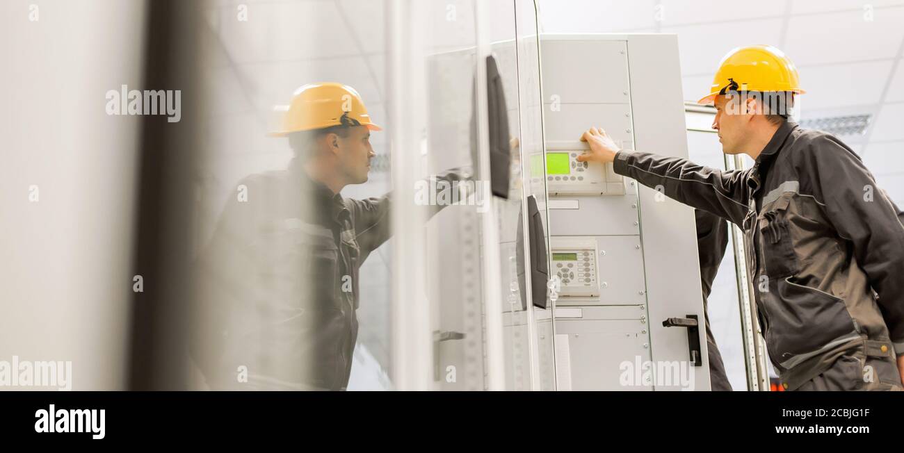 Maintenance engineer testing medium voltage switchgear and bay control ...