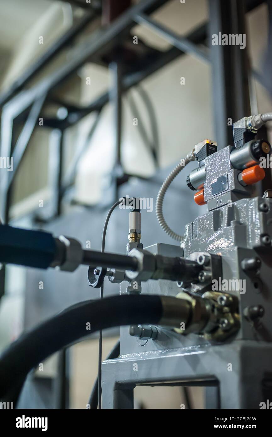 Mechanic automatic pump working at the factory. Industrial interior and ...