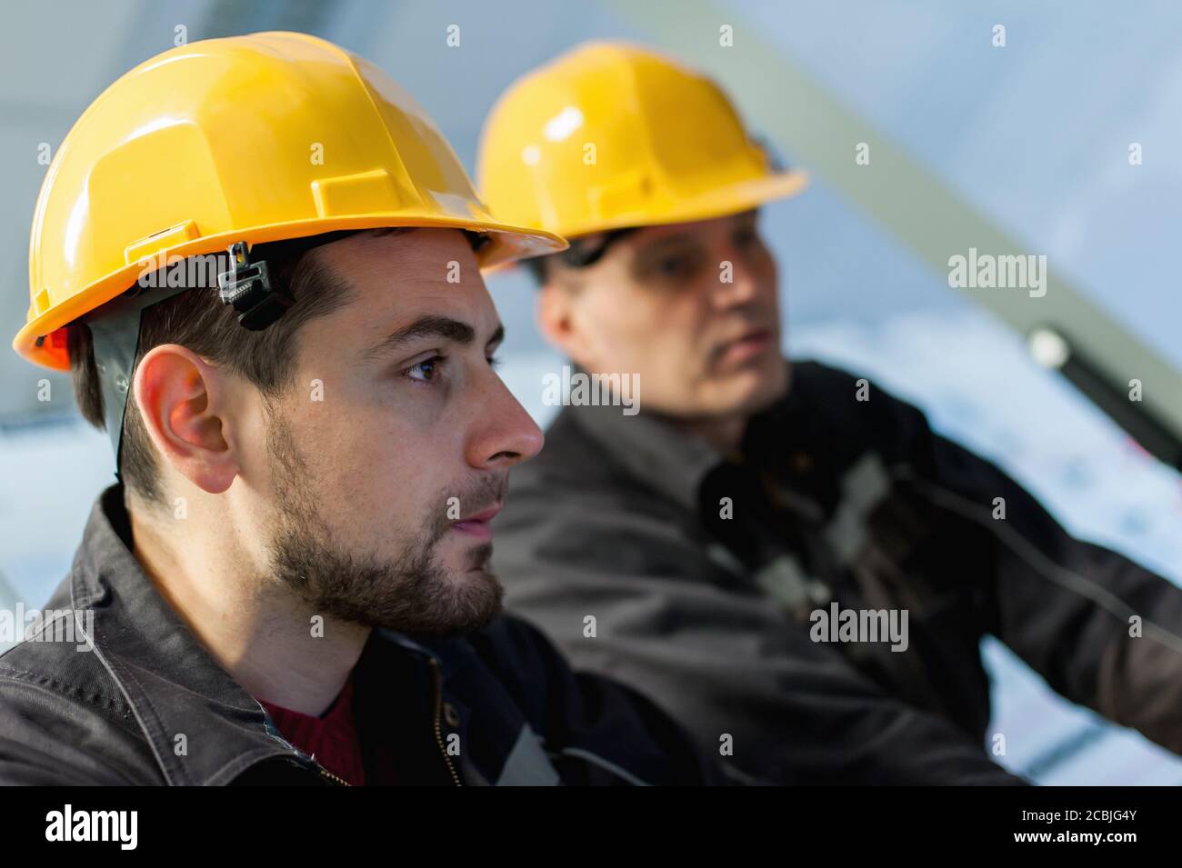 Two maintenance engineer work on relay protection system. Bay control ...