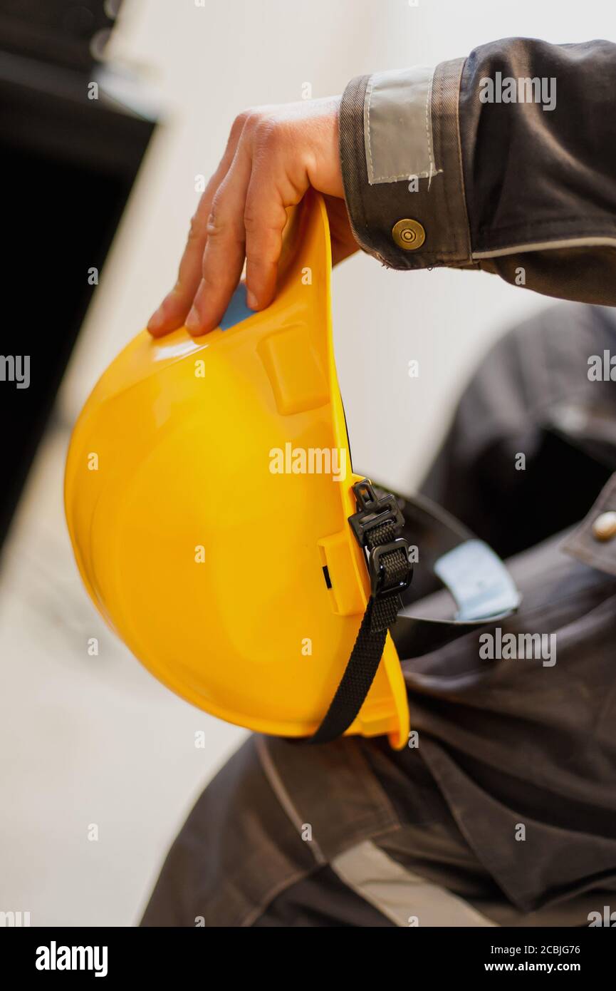 Helmet in the hand hi-res stock photography and images - Alamy