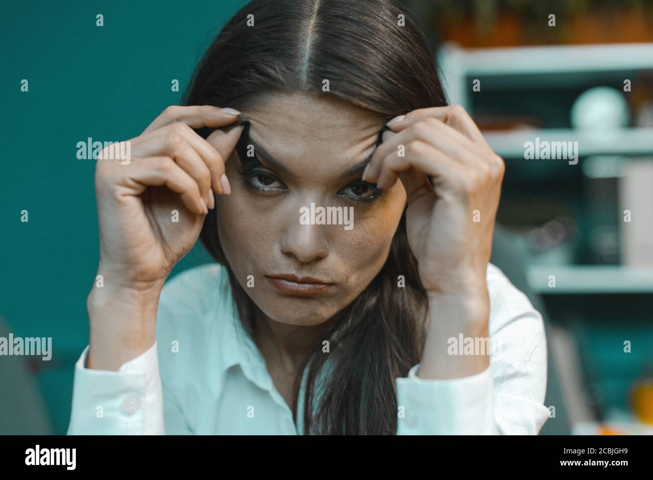 Tired sleepy businesswoman trying not to fall asleep in office while ...