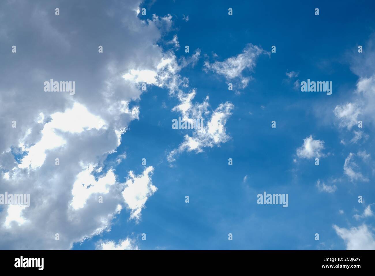 Clouds floating in blue sky Stock Photo - Alamy