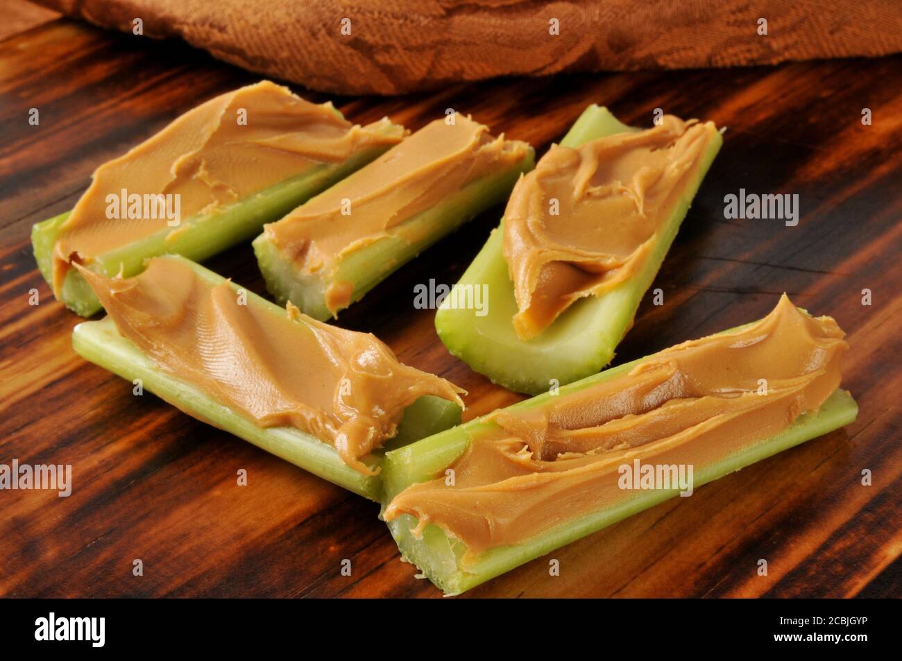 Celery sticks filled with creamy peanut butter Stock Photo - Alamy