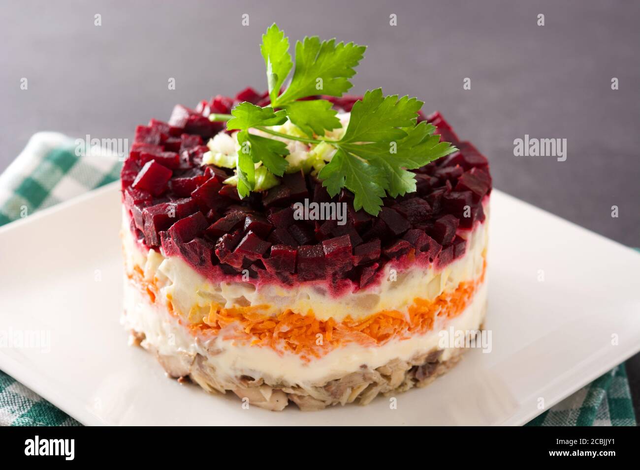 Traditional Russian herring salad with beetroot and carrots on black ...