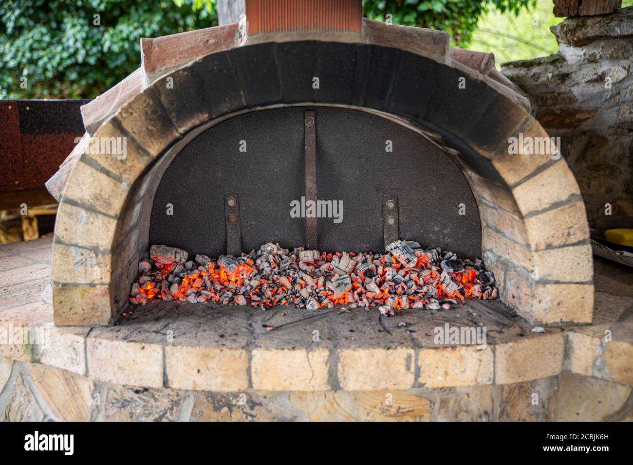 Burning oak wood in a furnace. Stove in country house. Bright flame ...