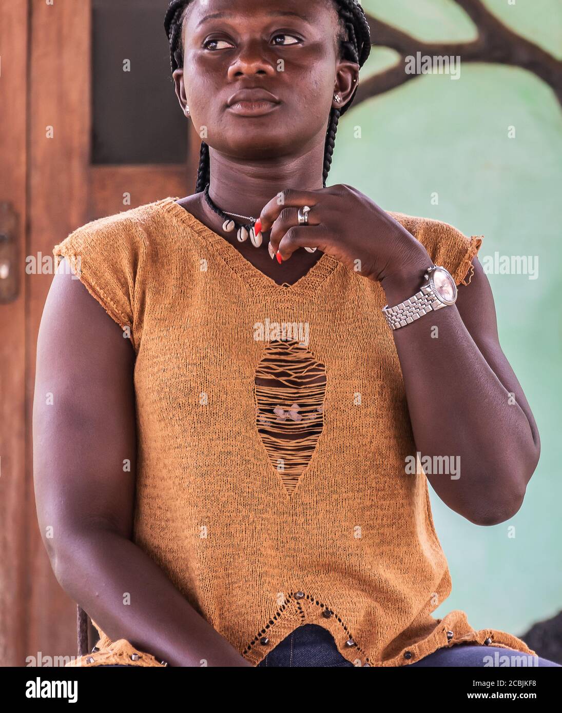 African woman Ghana looking at something in the village of Ada Foah ...