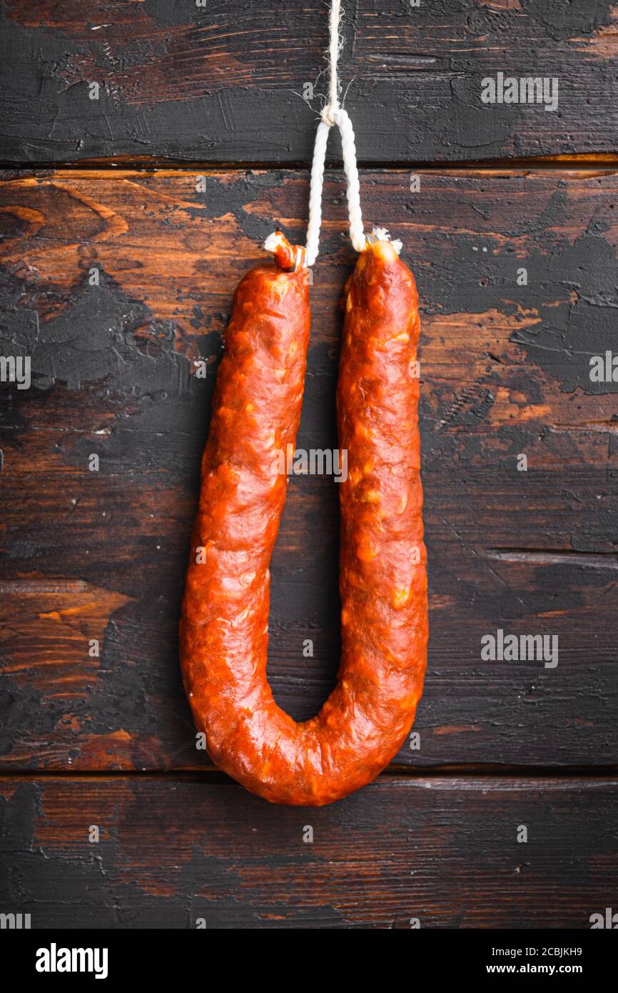 Traditional spanish chorizo sausage on old wooden table, topview Stock ...