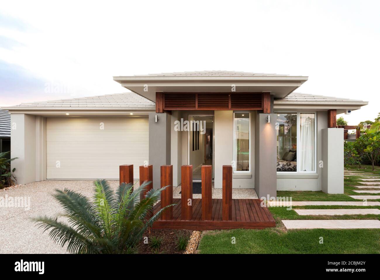 Front view of a modern house with garage Stock Photo - Alamy