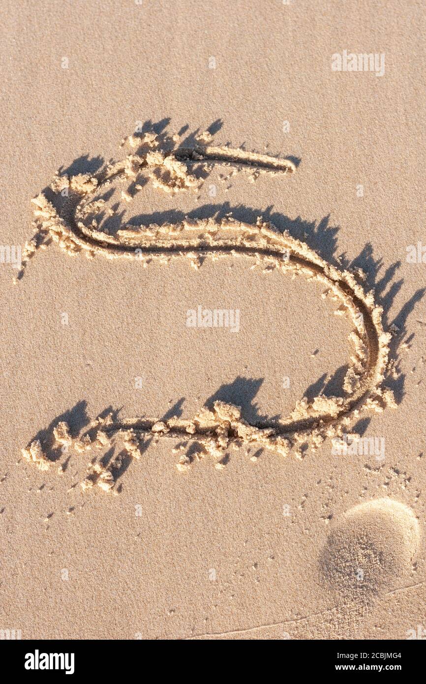 S - Alphabet letter written on sand Stock Photo - Alamy