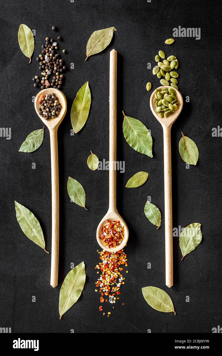 Layout of various spices in spoons. Top view, copy space Stock Photo ...