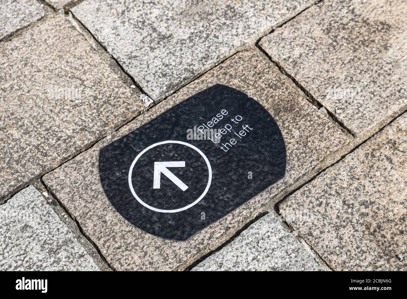 A keep to the left direction sign to help with social distancing at the ...