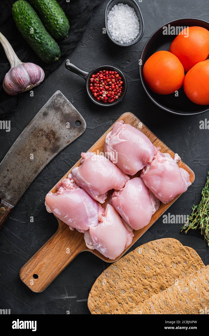 Doner ingredients, chicken thighs on black background, flat lay Stock ...