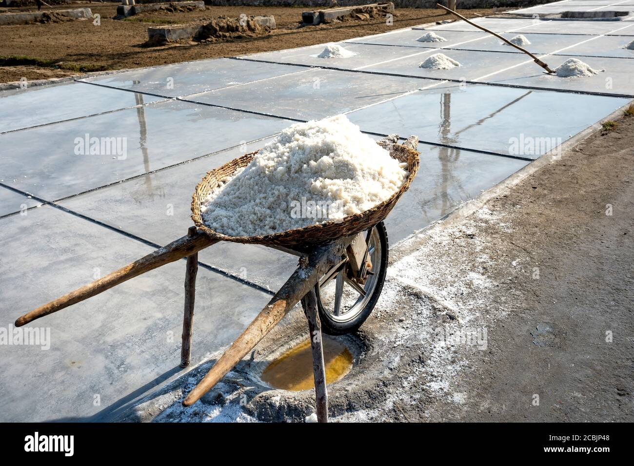 The image of a wooden wheelbarrow for transporting salt of salt farmers ...