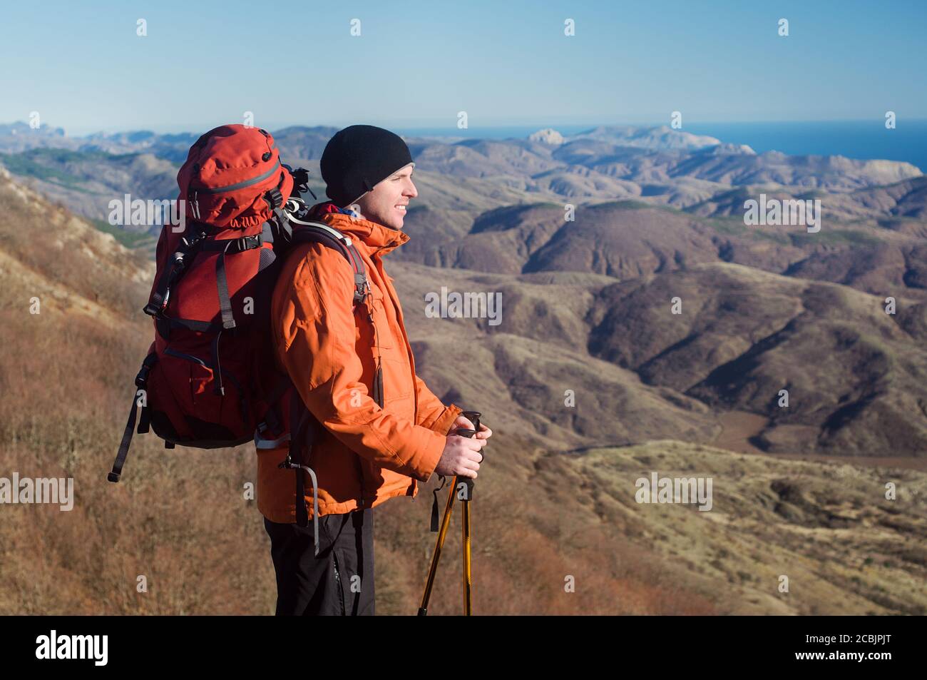Hiking man with backpack Stock Photo - Alamy