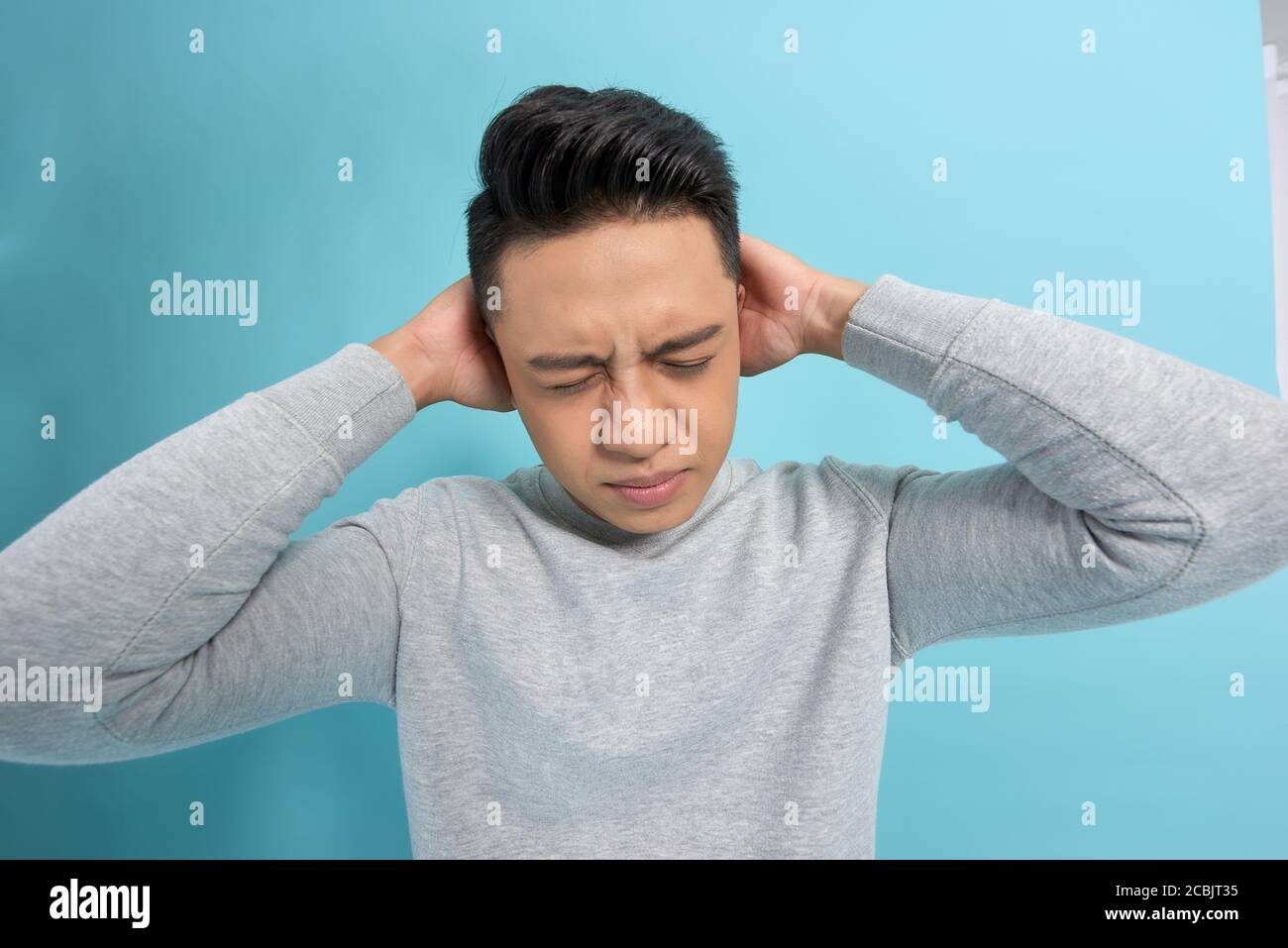 Emotion concept, Young asian man angry expression isolate on blue ...