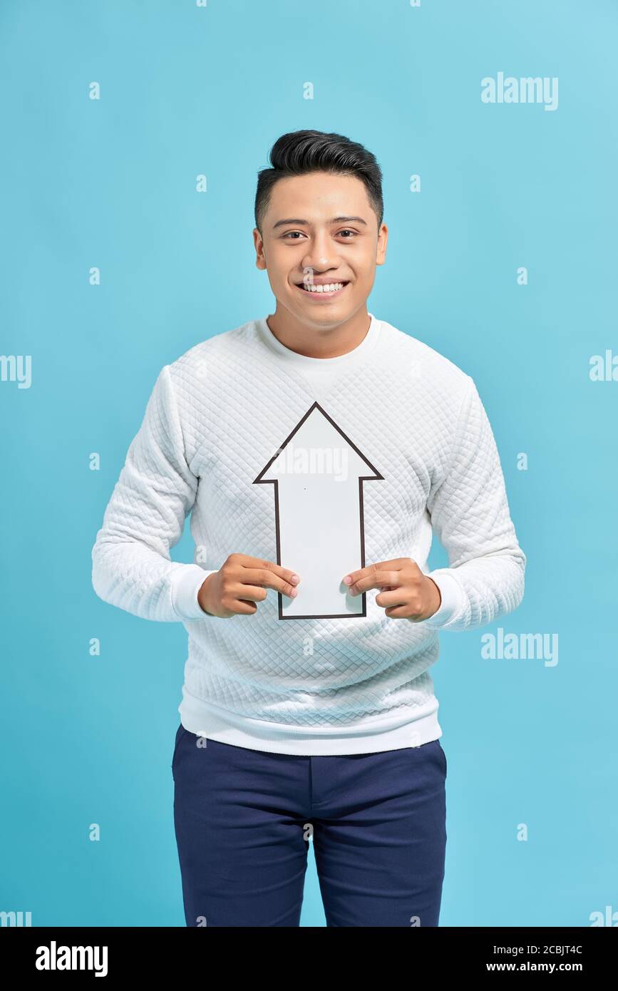 Man holding arrow sign hi-res stock photography and images - Alamy