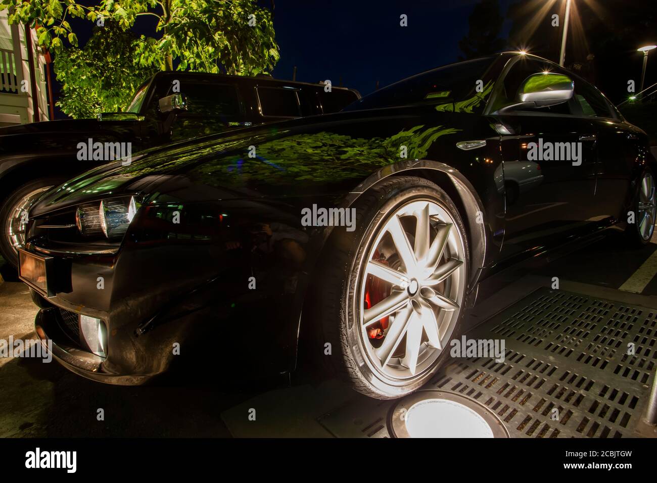 A car parked on the side of a road Stock Photo - Alamy