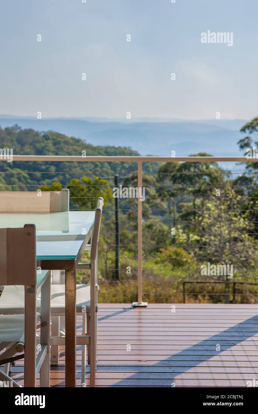Open air dining area with chairs and table Stock Photo - Alamy