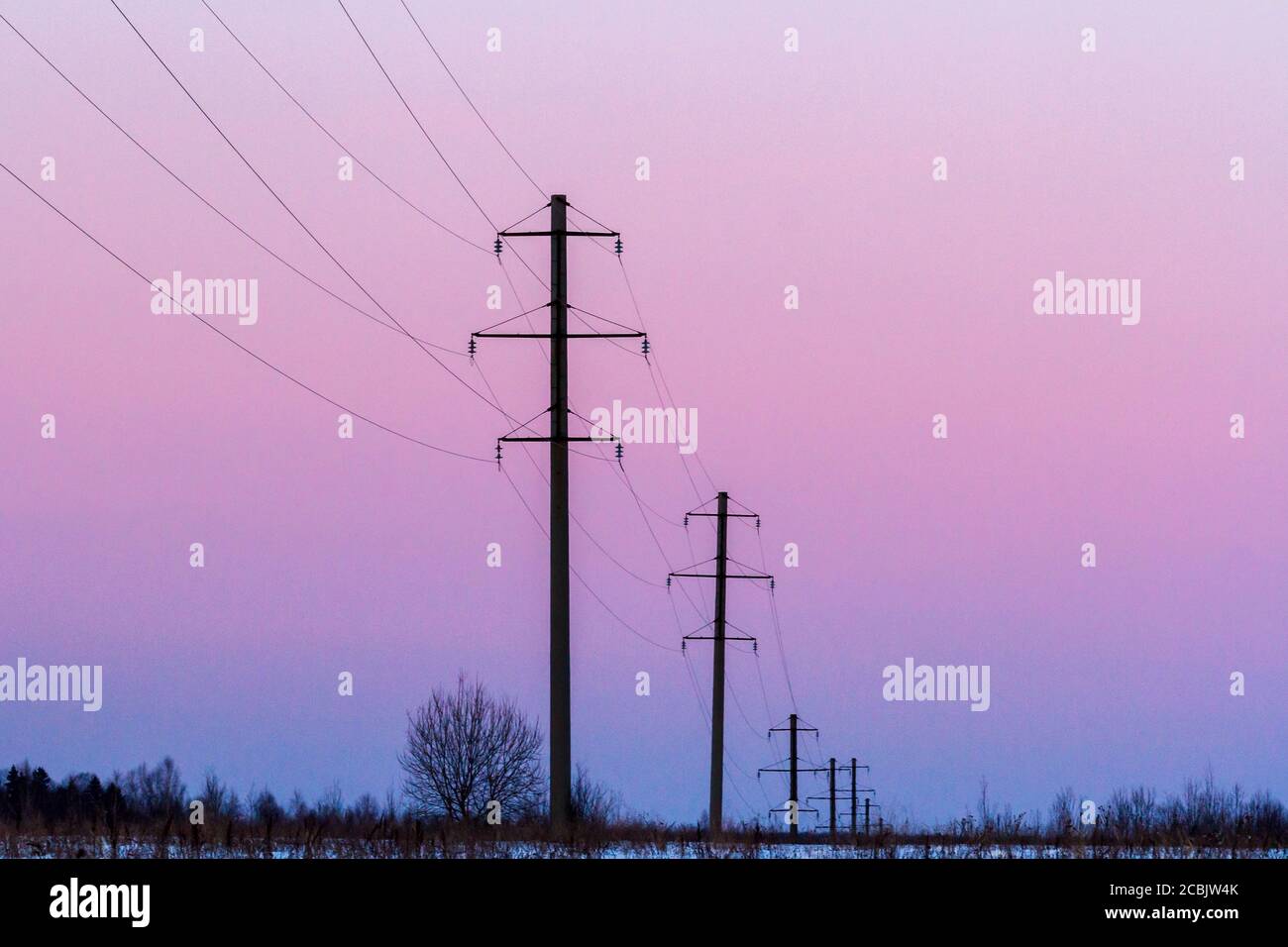 Row of power lines near country road on the sunset in the winter Stock ...