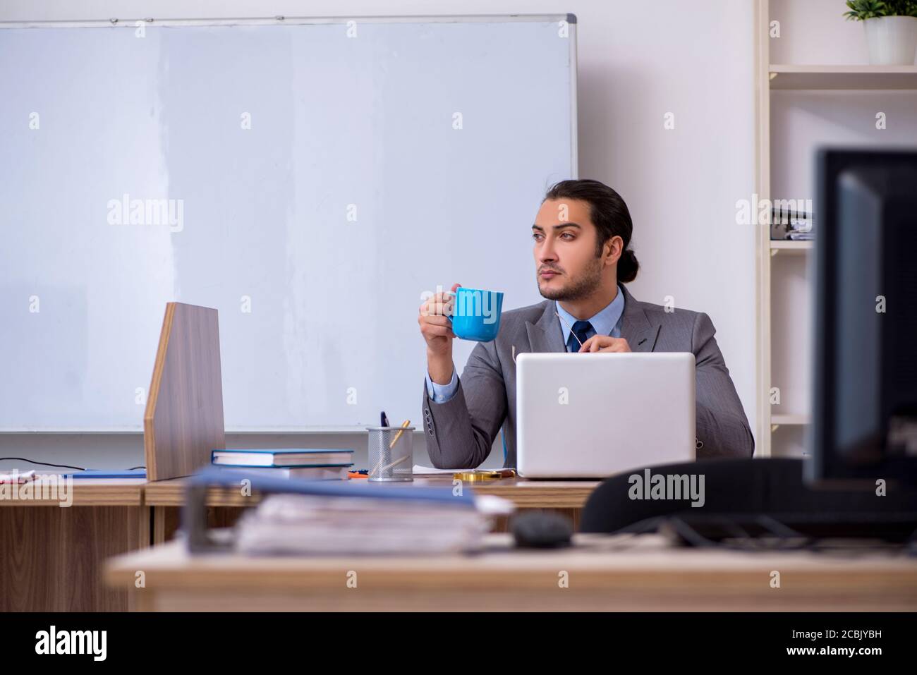 Male businessman employee working in the office Stock Photo - Alamy