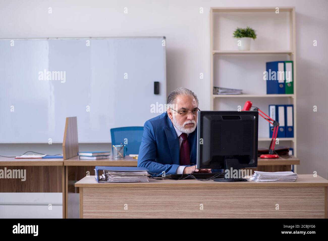 Male boss employee working in the office Stock Photo - Alamy